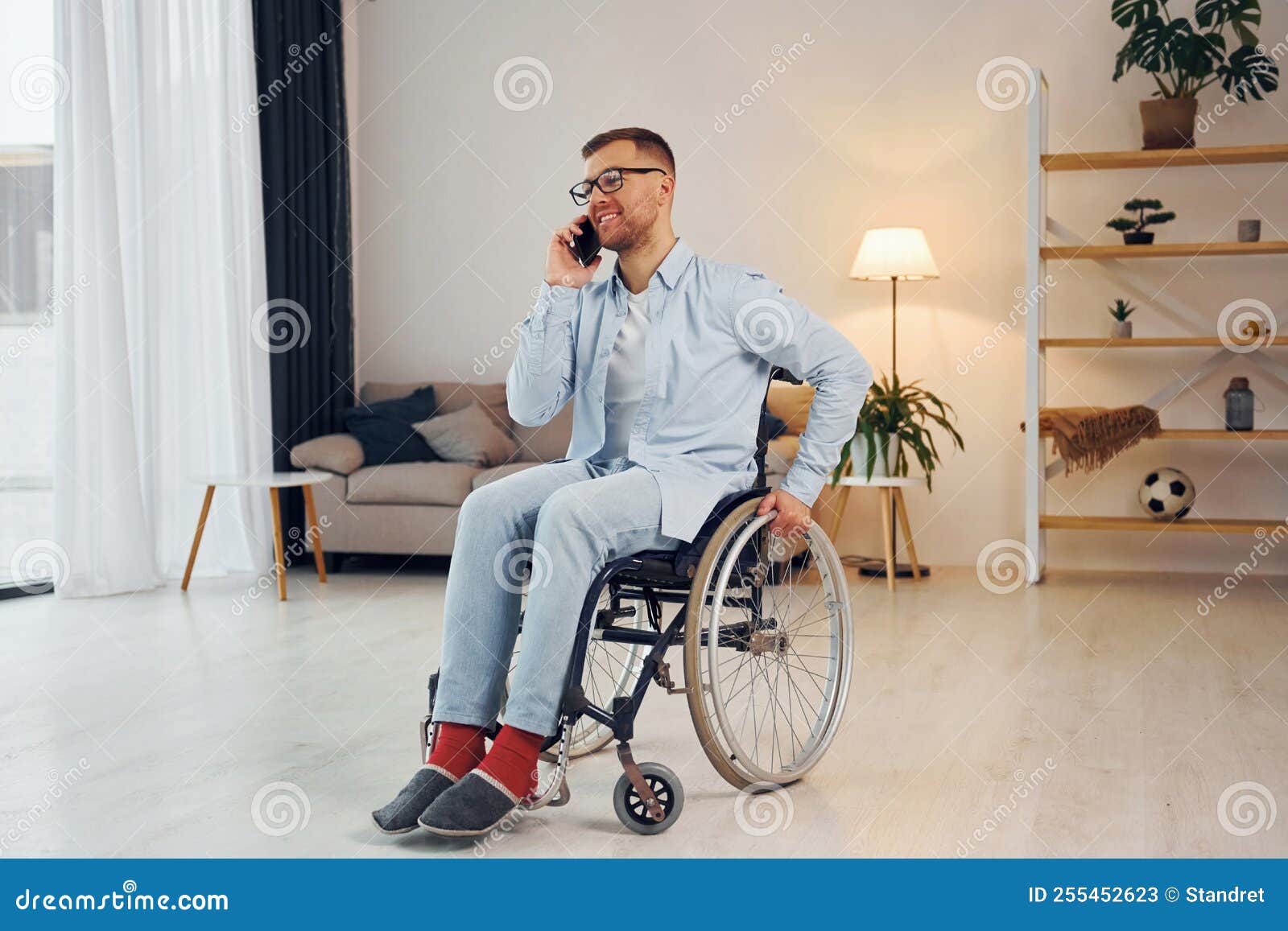 Using Phone. Disabled Man in Wheelchair is at Home Stock Image - Image ...