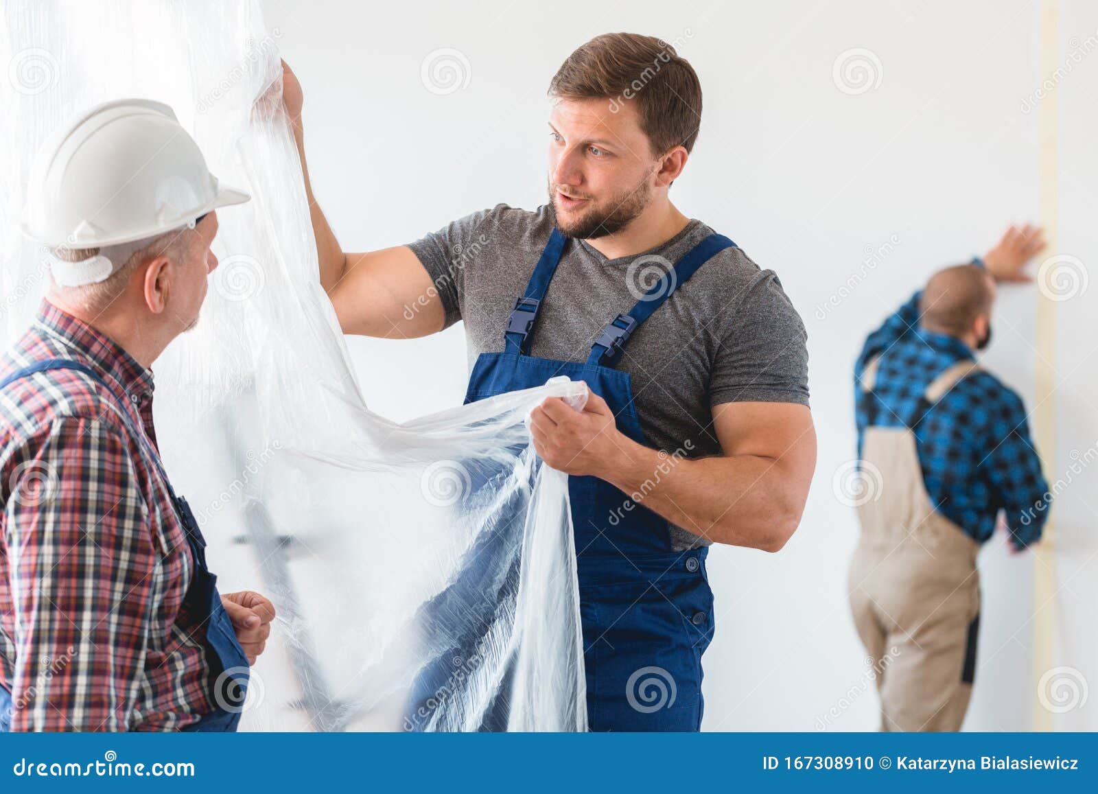 Using protective foil stock photo. Image of helmet, painter - 167308910