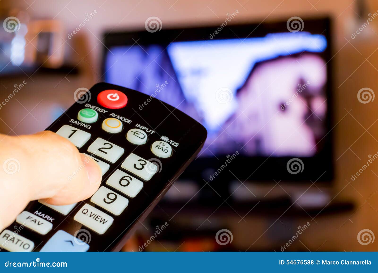 Using the Remote Control To Change Channesl on Tv Stock Photo - Image ...