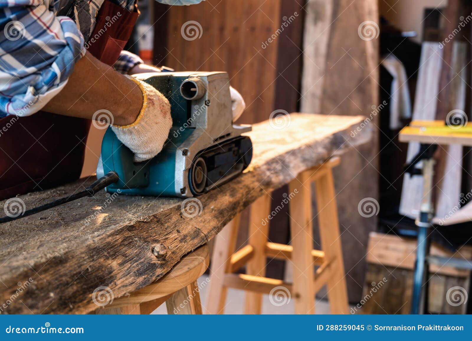 Using Sanding Machine Belt Sander To Level Surface Wood. Carpenter Use ...
