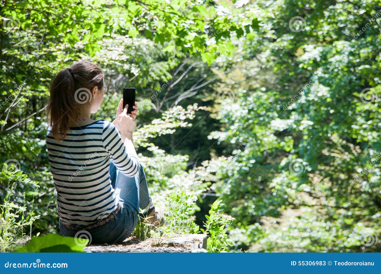 Using a Smart Phone in the Forest Stock Image - Image of green, hiker ...