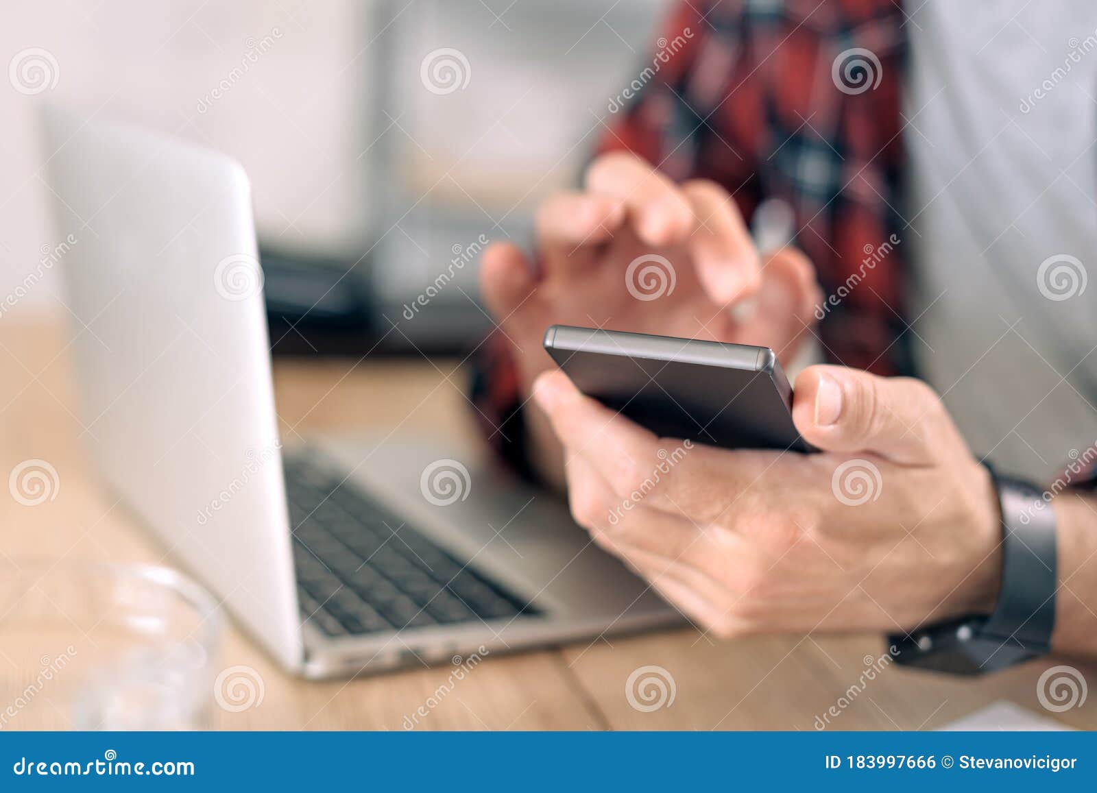 Using Smart Phone and Laptop Computer in Home Office Stock Photo ...