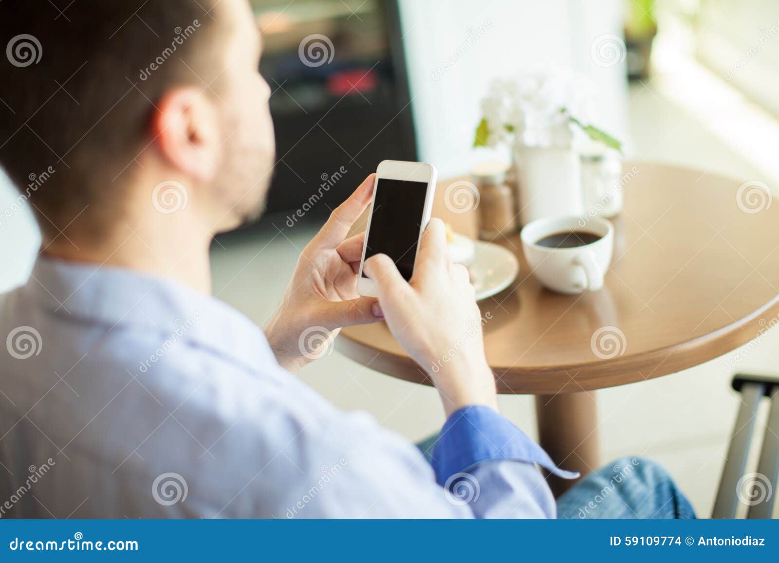 Using a Smartphone in a Cafe Stock Photo - Image of restaurant, food ...