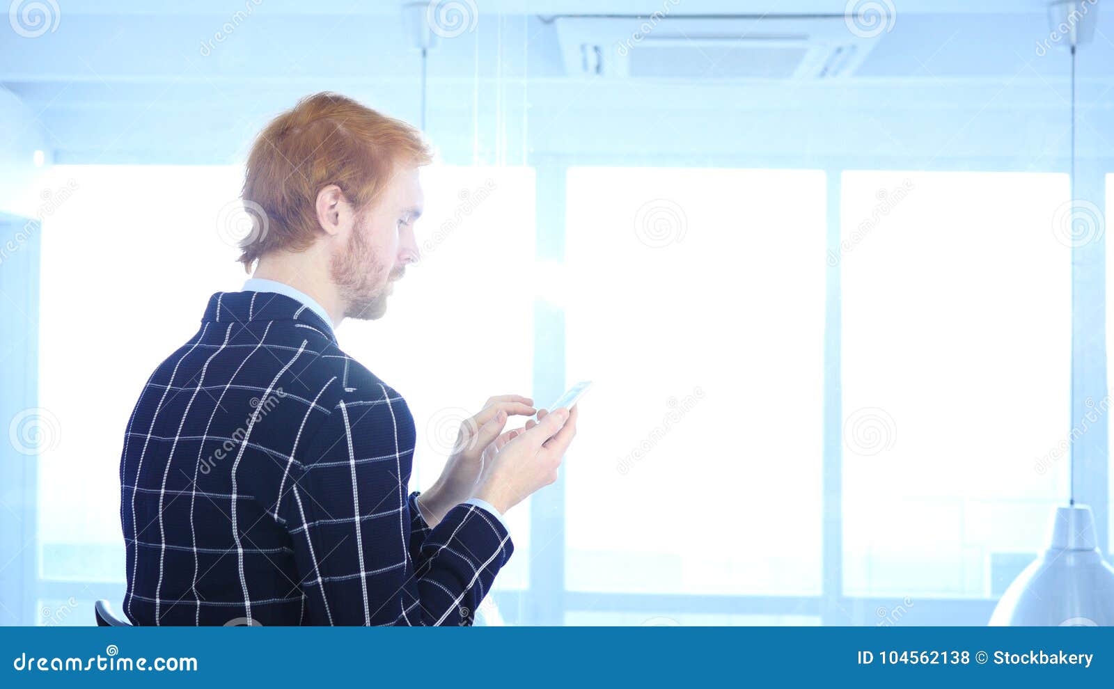 Using Smartphone for Reading Emails Nad Messages, Man with Red Hairs ...