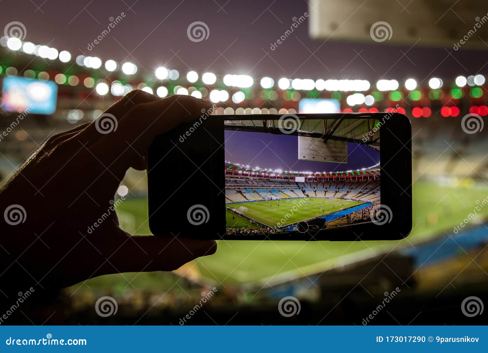 Using a Smartphone on Soccer Stadium Stock Photo - Image of connection ...