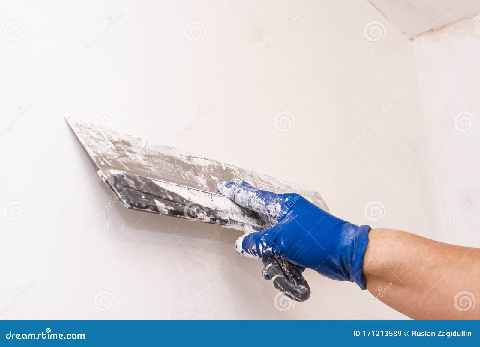 Using a Spatula Align the Wall. Interior Decoration Stock Image - Image ...