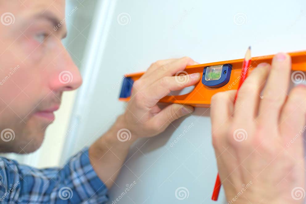 Using Spirit Level To Check Wall Straight Stock Photo - Image of ...