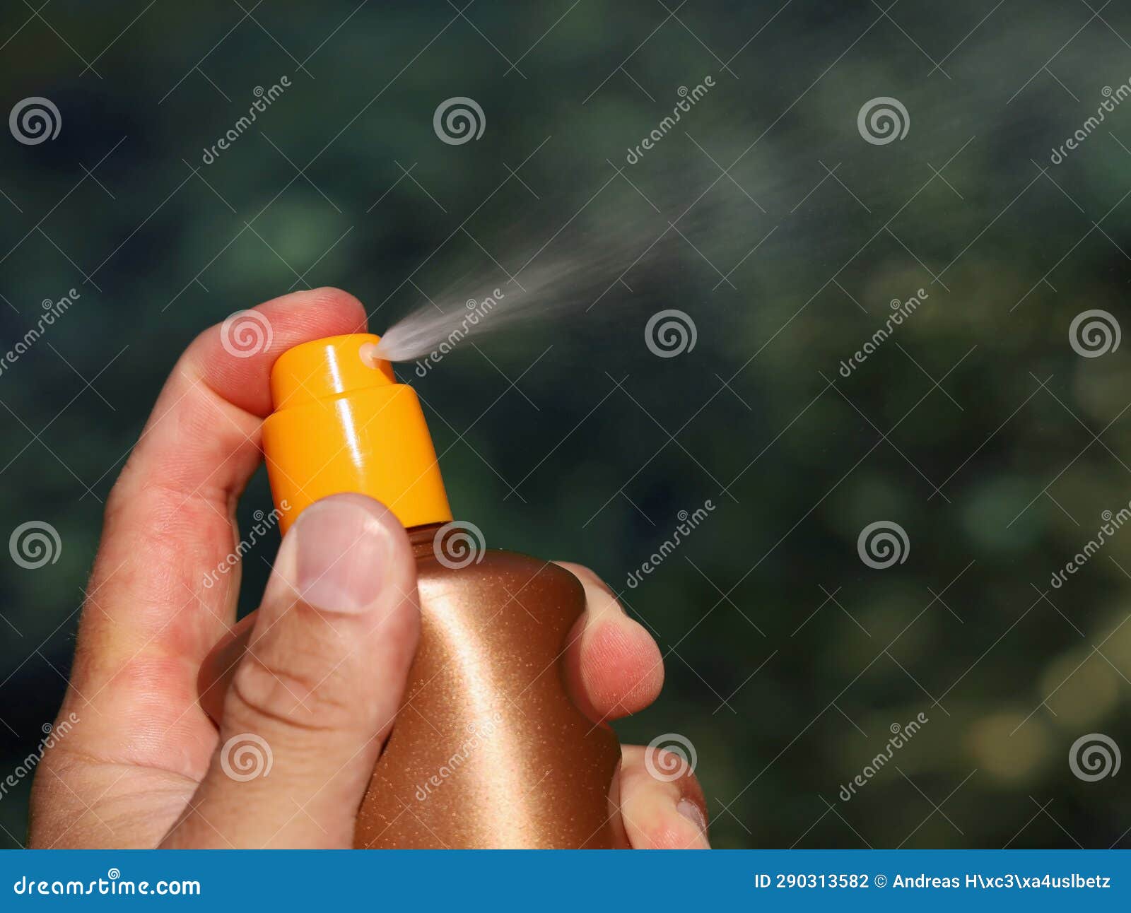 Using a Spray Bottle with Sunscreen Cream on the Beach, Concept of Skin ...