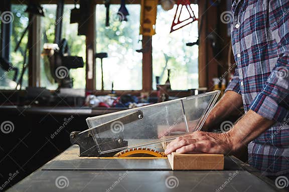 Using a table saw stock image. Image of industry, carpentry - 95696407