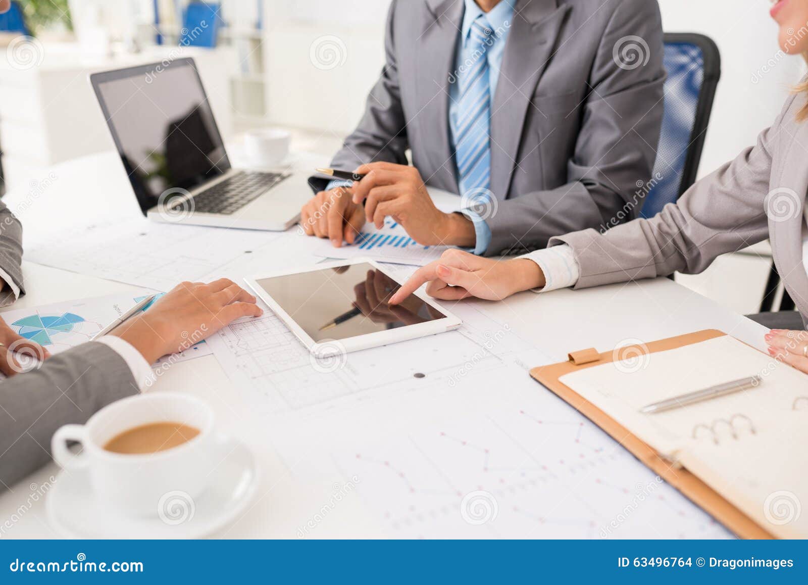 Using tablet at meeting stock photo. Image of hands, analyzing - 63496764