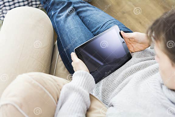 Using tablet pc at home stock image. Image of friends - 37850159