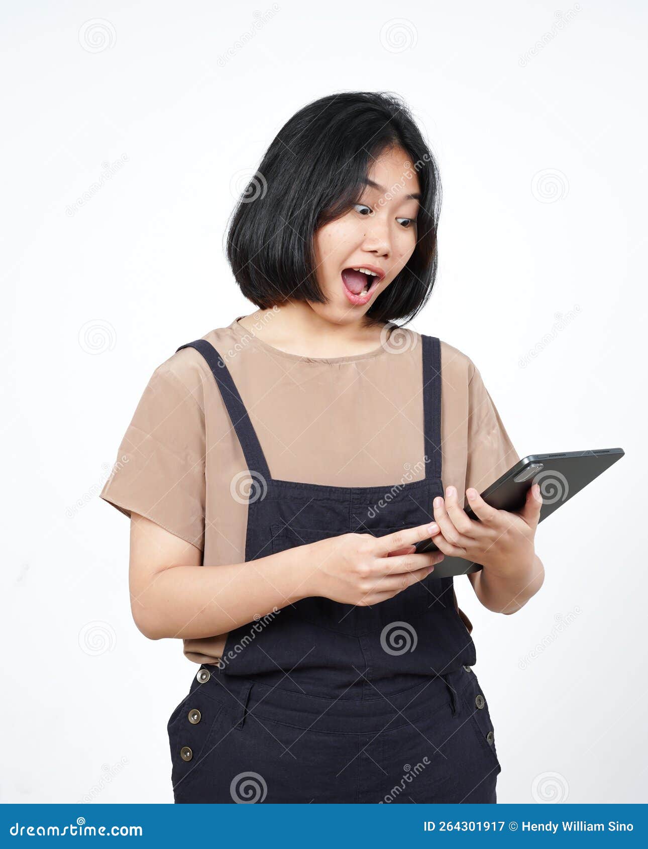 Using Tablet with Wow Face Expression of Beautiful Asian Woman Isolated ...