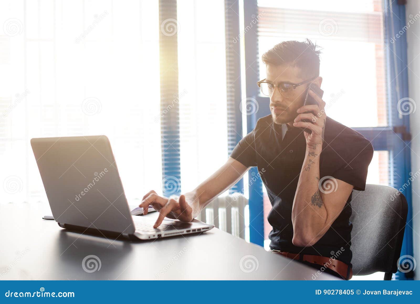 Using Technology To His Advantage in the Office Stock Image - Image of ...