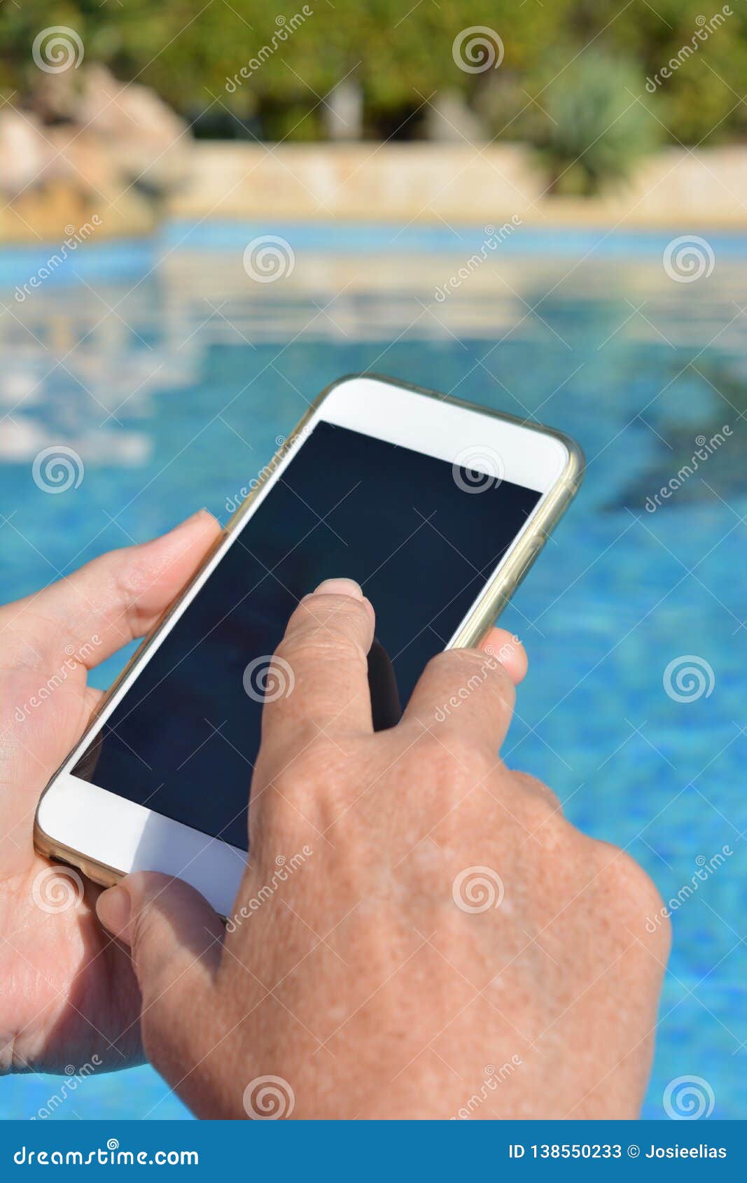 Using Technology, Using a Mobile Phone by a Swimming Pool in Summer ...