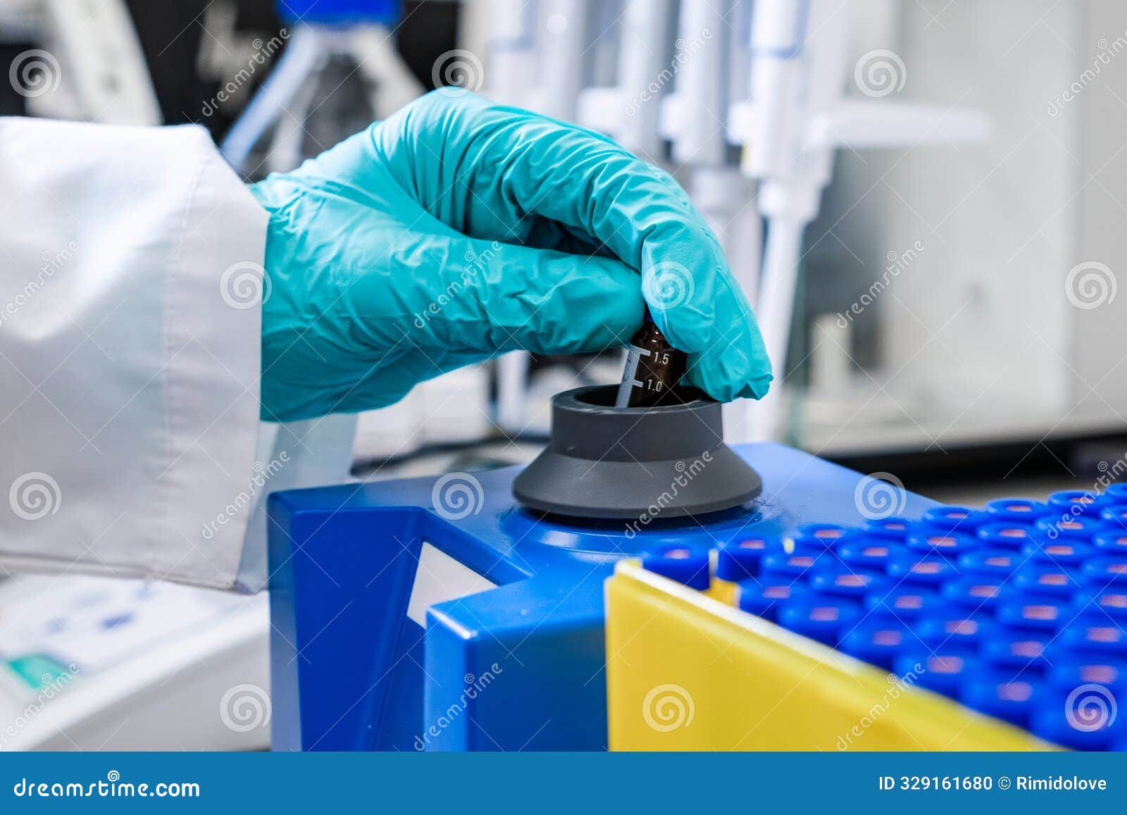 Using a Vortex Mixer, a Chemist Agitates Samples before Conducting HPLC ...