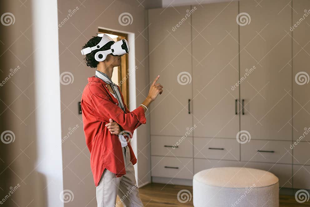 Using VR Headset, Young Man Exploring Virtual Environment in Modern ...