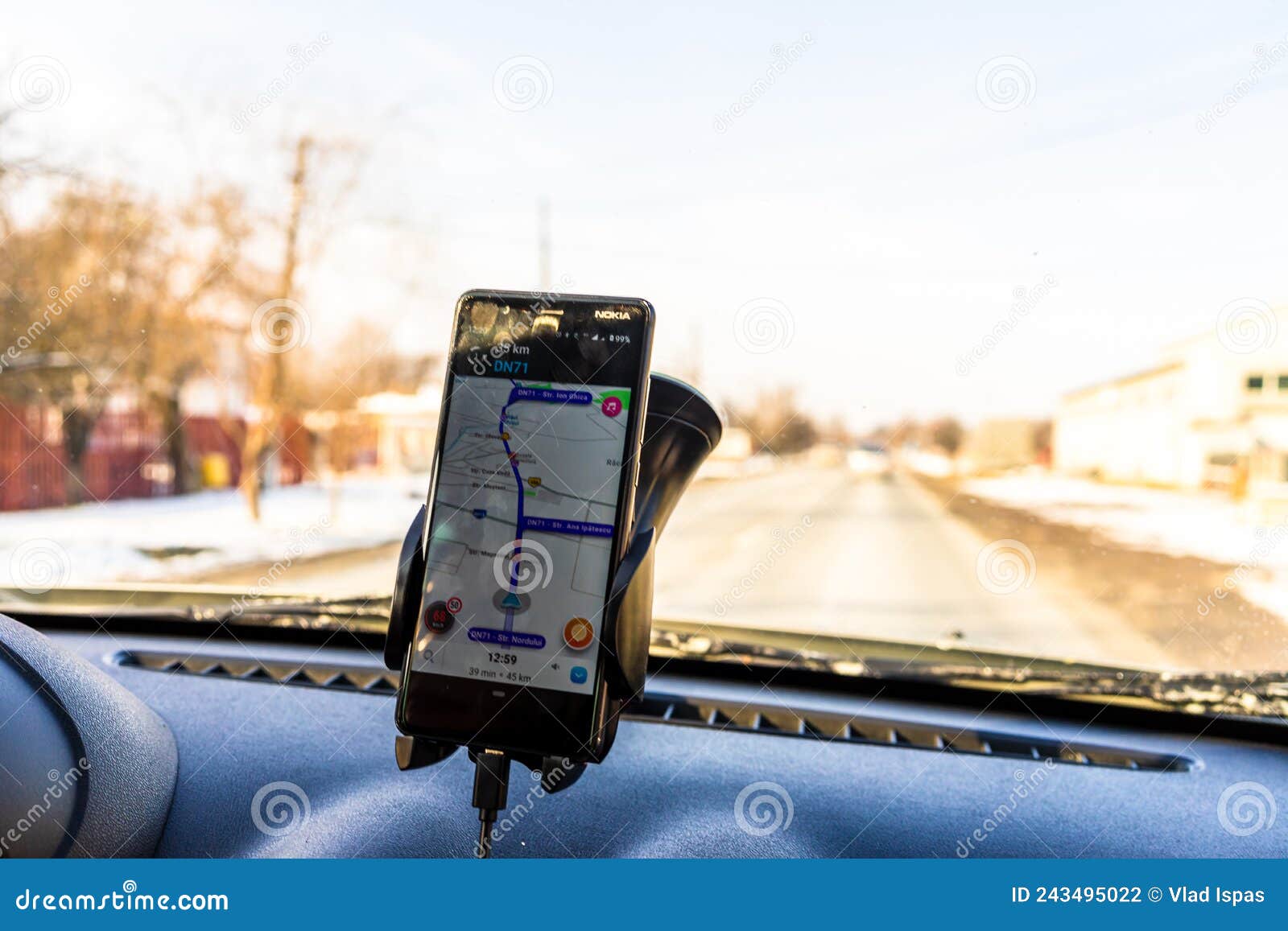 Using Waze Maps Application on Smartphone in Car Dashboard. Driver ...