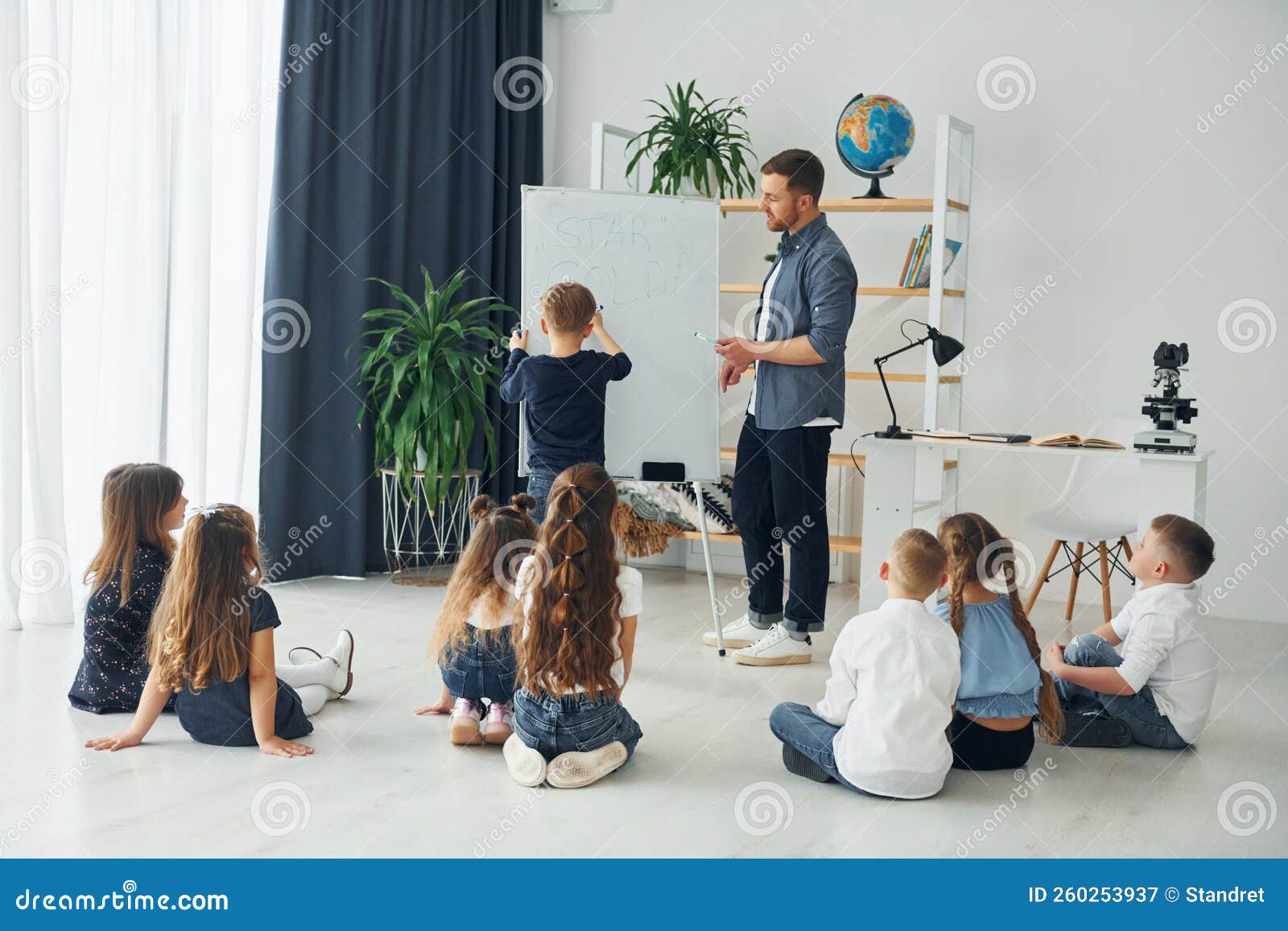 Using Whiteboard. Group of Children Students in Class at School with ...