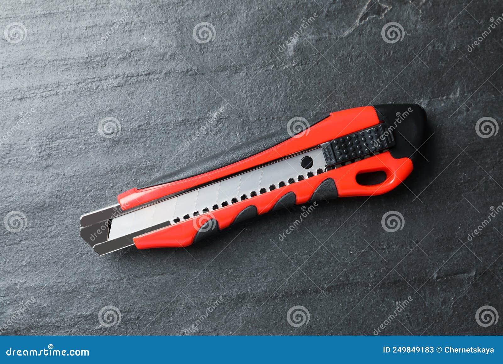 Utility Knife on Black Table, Top View. Construction Tool Stock Image ...
