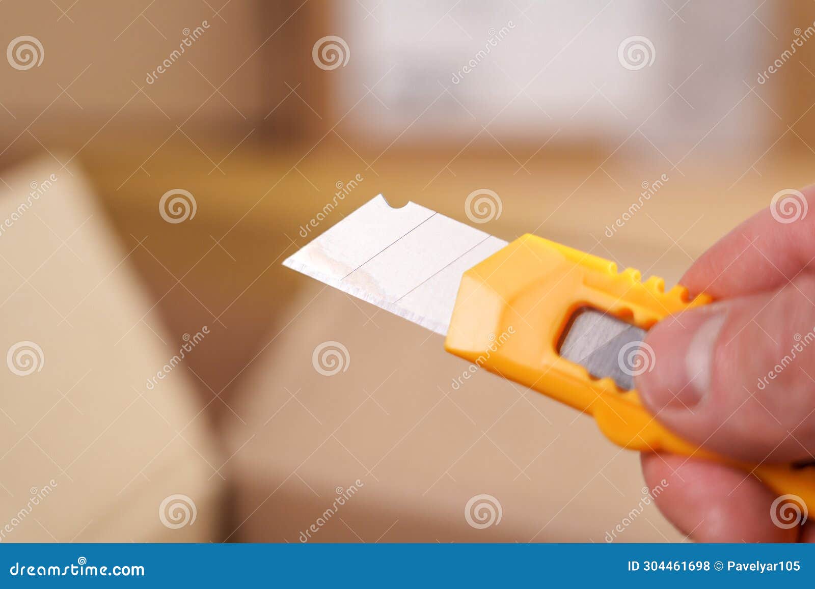 Utility Knife or Box Cutter in Hand with Retractable Segmented Blade ...