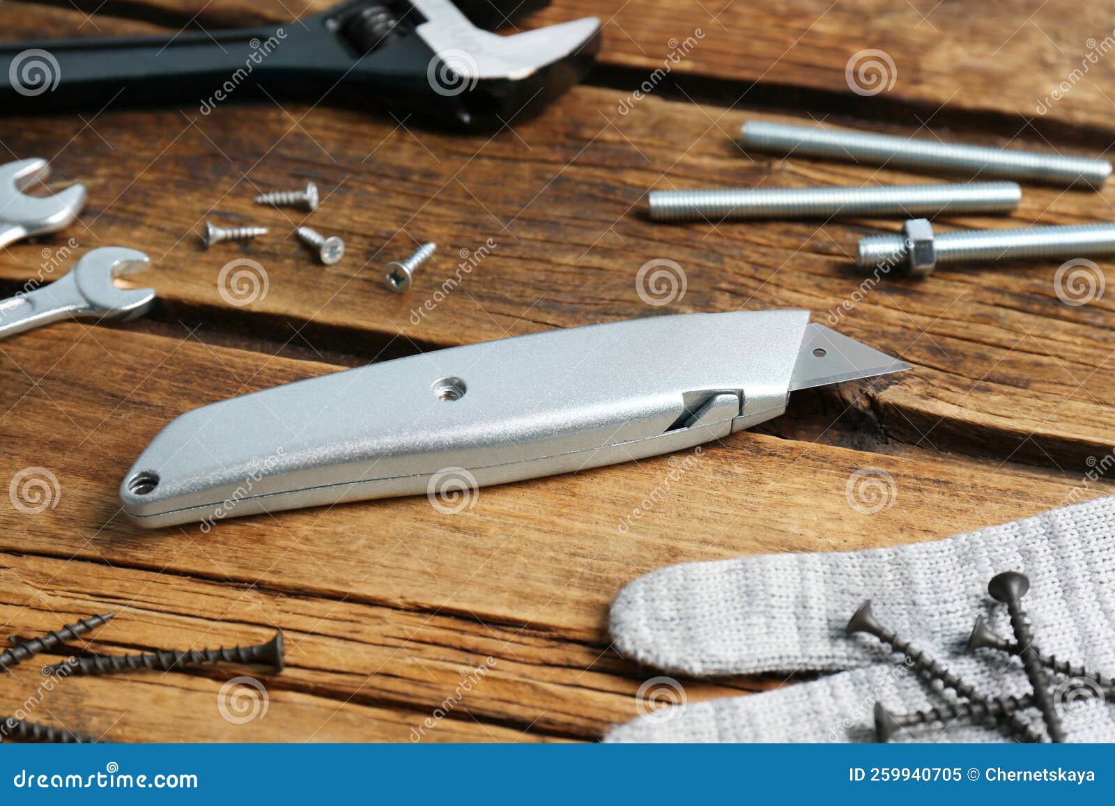 Utility Knife and Different Tools on Wooden Table Stock Image - Image ...