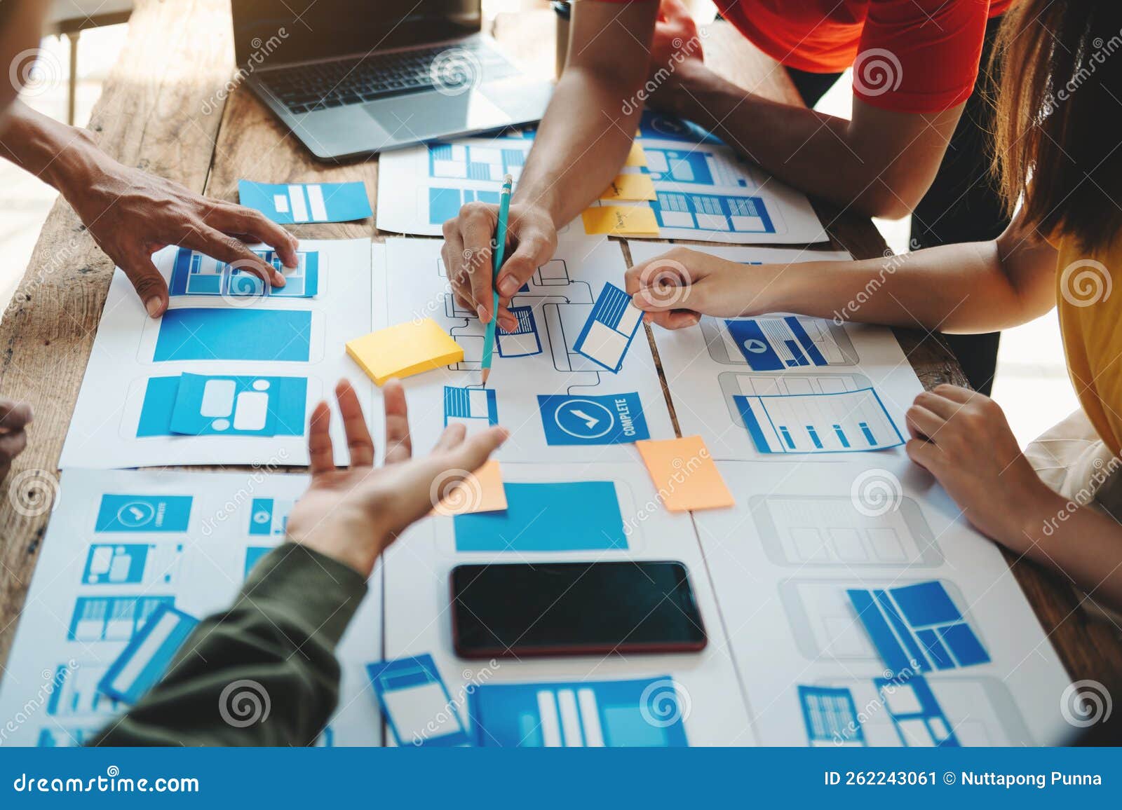Ux Developer And Ui Designer Brainstorming About Mobile App Interface Wireframe Design With