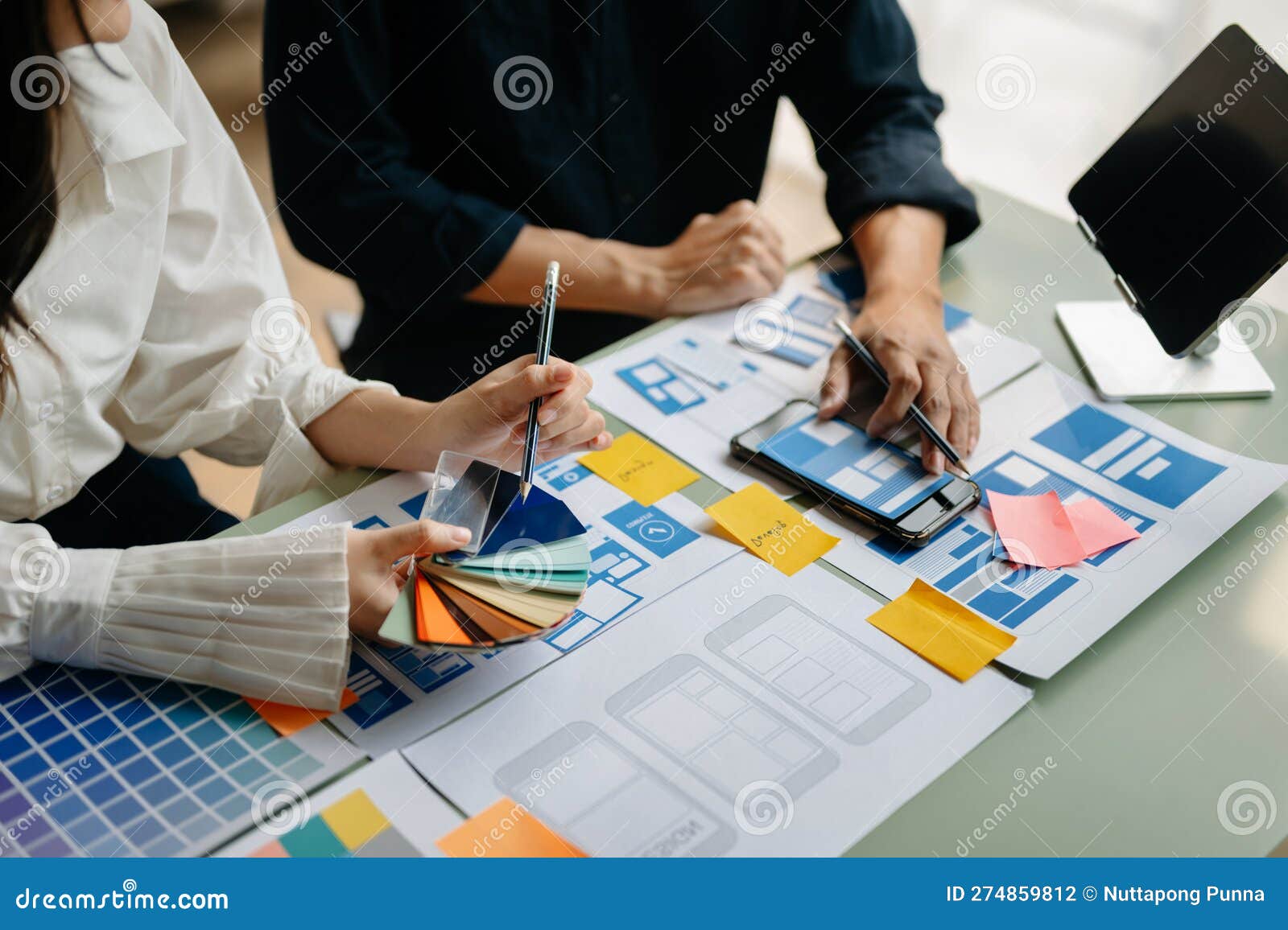 Ux Developer And Ui Designer Brainstorming About Mobile App Interface Wireframe Design With