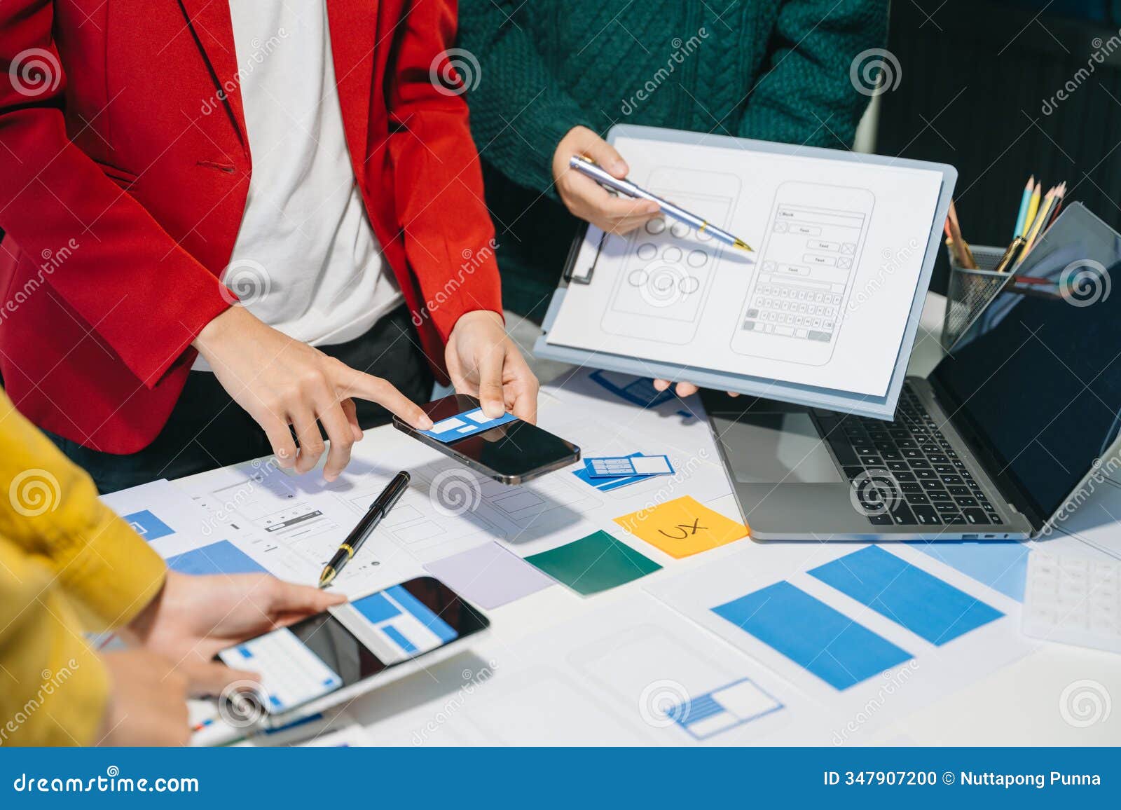 Ux Developer And Ui Designer Brainstorming About Mobile App Interface