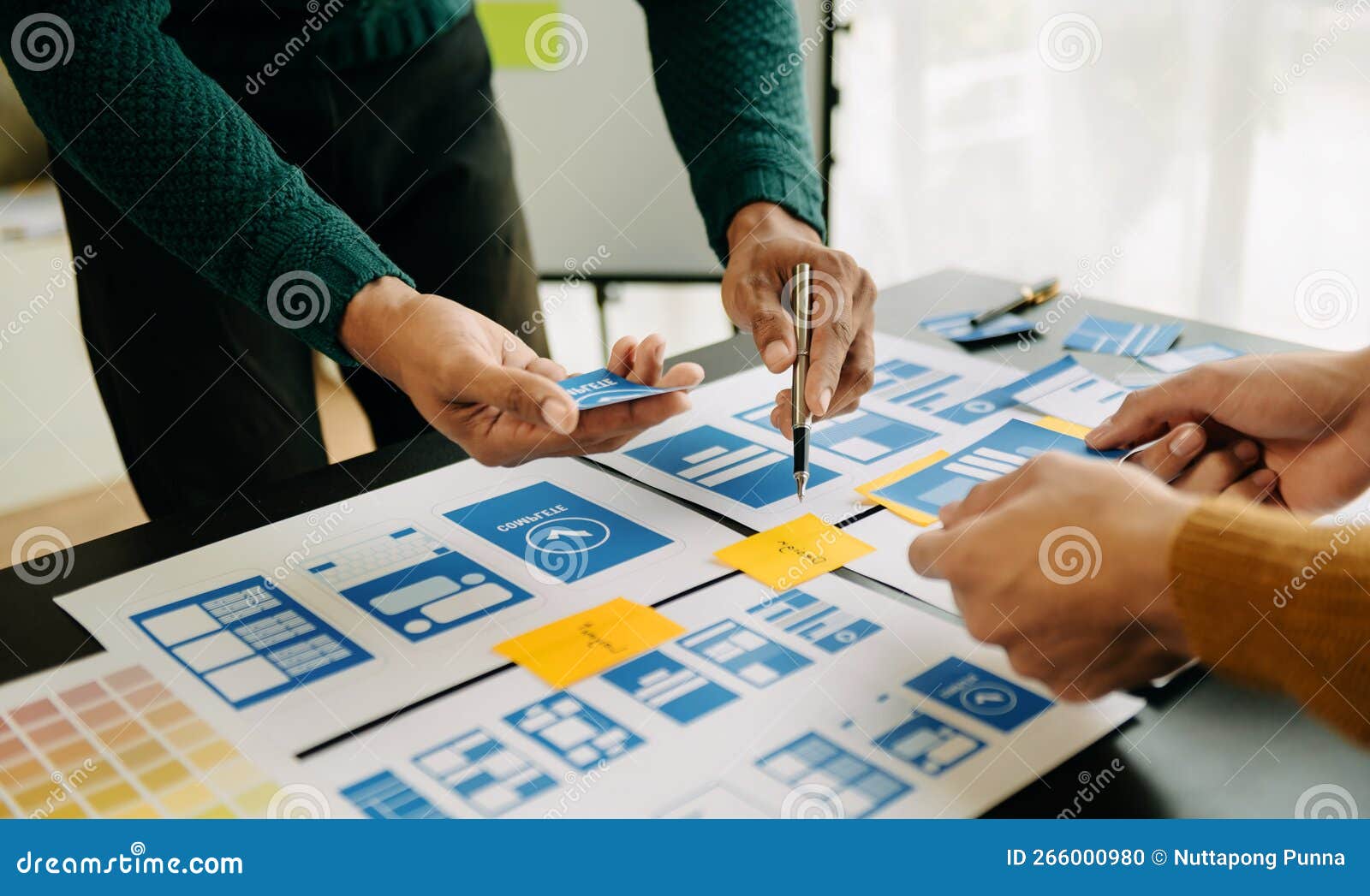 Ux Developer And Ui Designer Brainstorming About Mobile App Interface Wireframe Design With