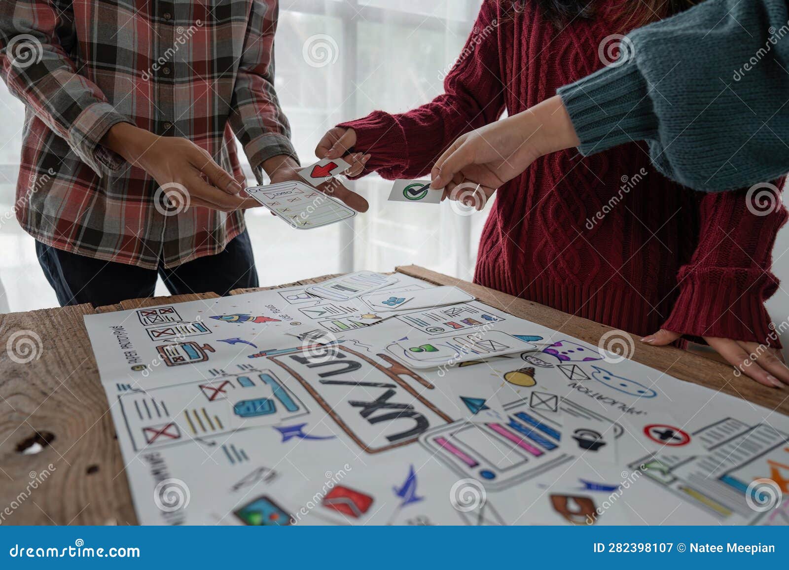 Ux Developer And Ui Designer Brainstorming About Mobile App Interface Wireframe Design At Modern
