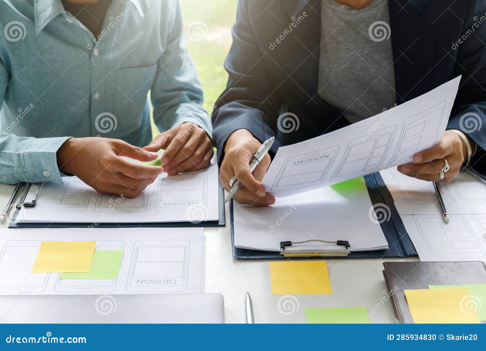 UX or UI Designers Designing on Their Smartphone Application Layout ...