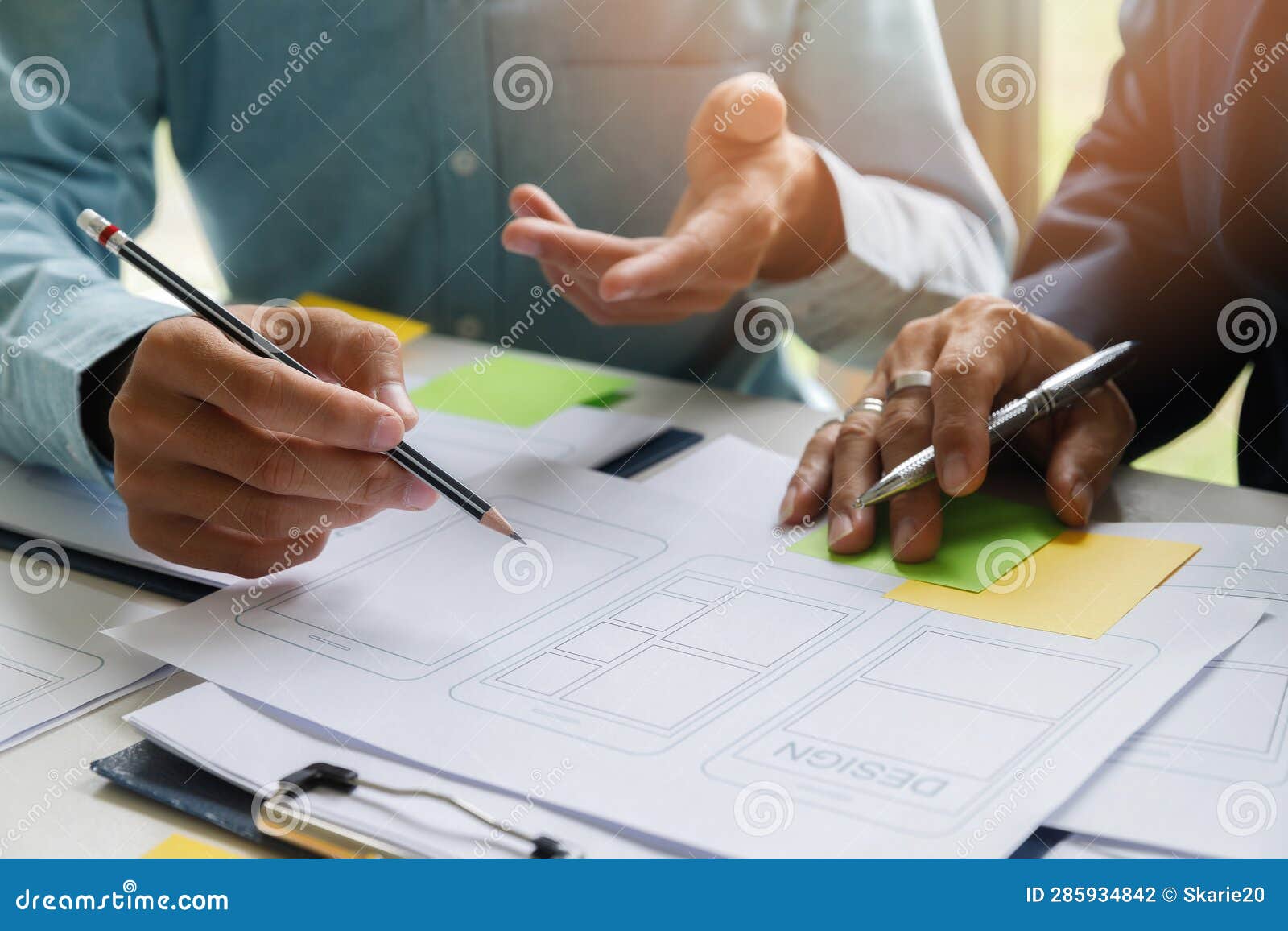 UX or UI Designers Designing on Their Smartphone Application Layout ...