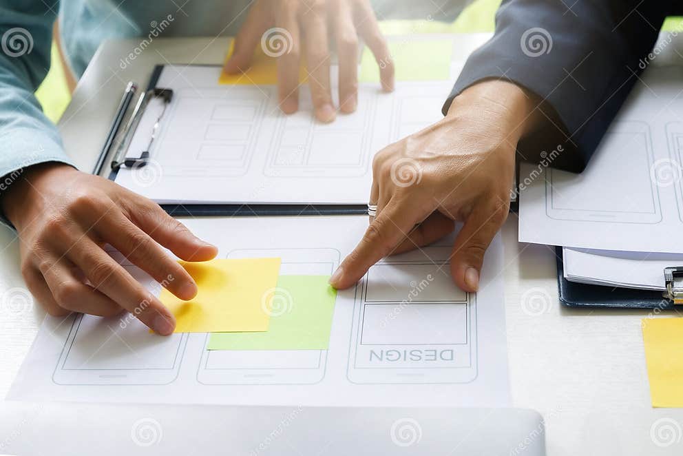 UX or UI Designers Designing on Their Smartphone Application Layout ...