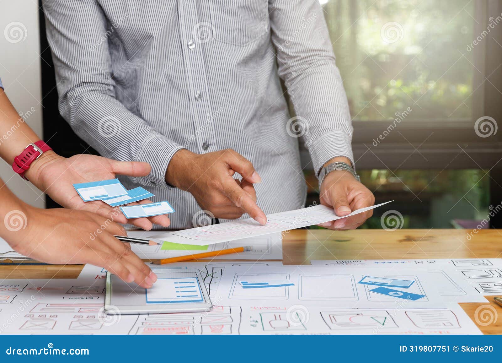 UX or UI Designers Designing on Their Smartphone Application Layout ...