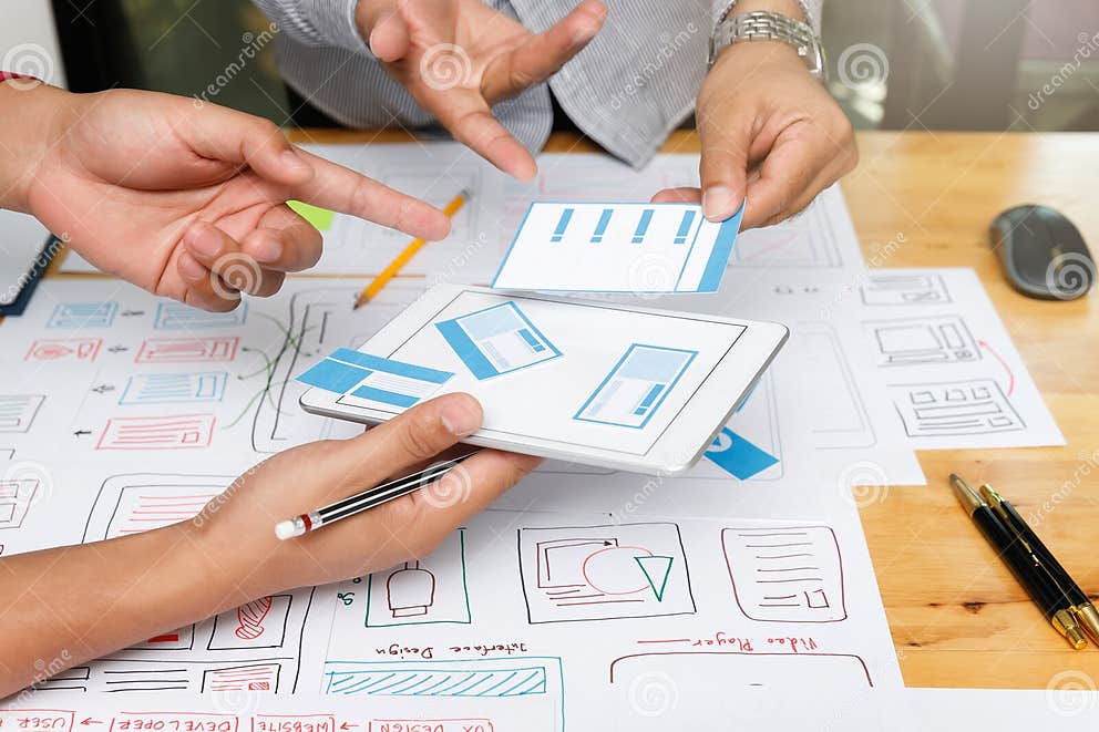 UX or UI Designers Designing on Their Smartphone Application Layout ...