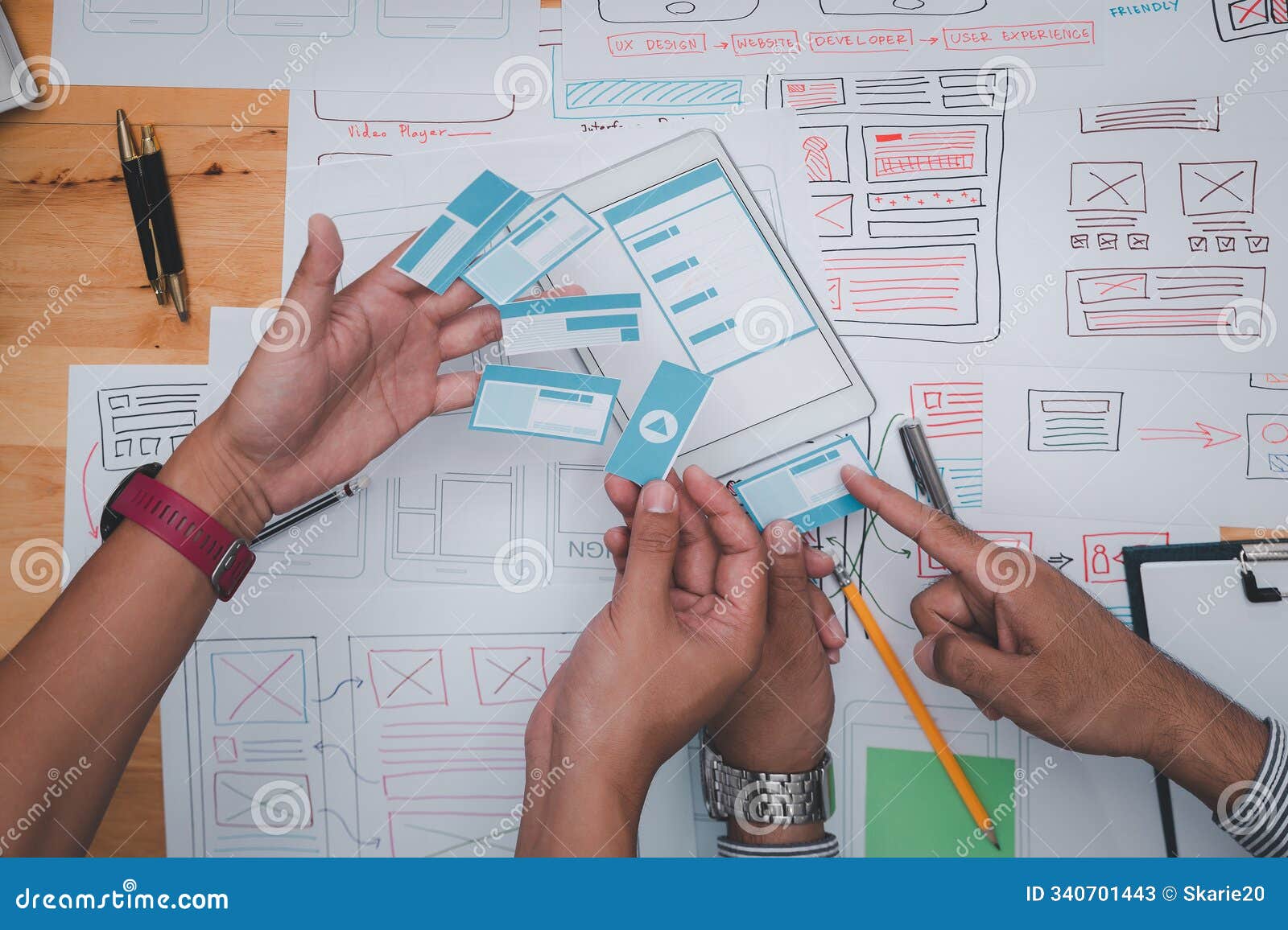 UX or UI Designers Designing on Their Smartphone Application Layout ...