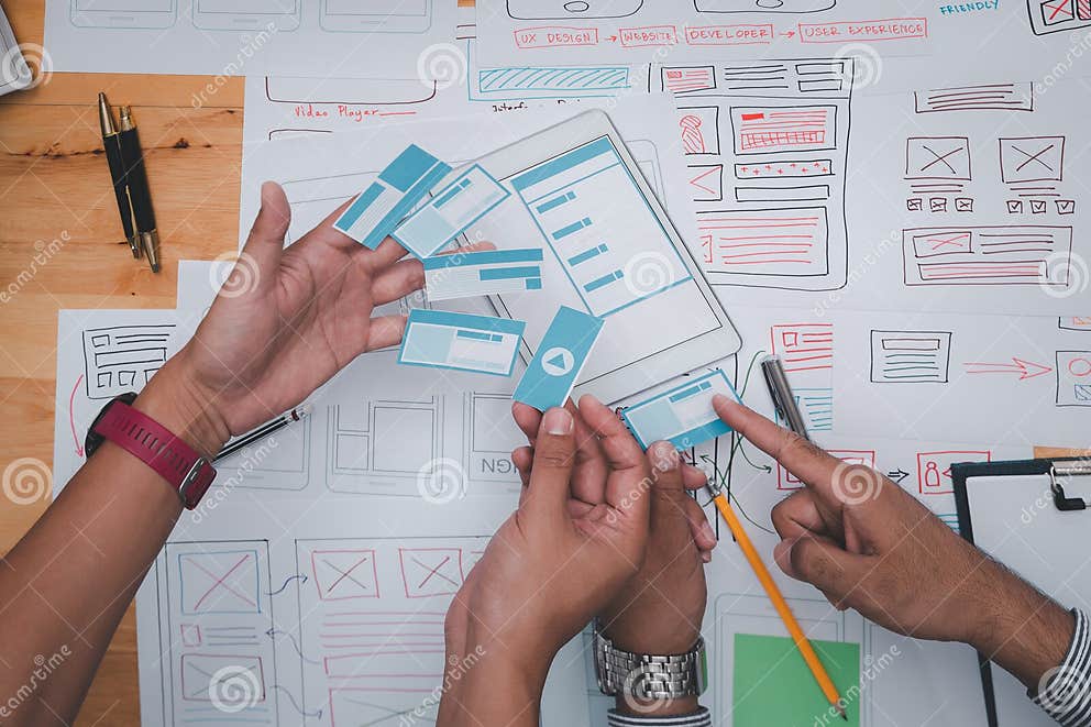 UX or UI Designers Designing on Their Smartphone Application Layout ...