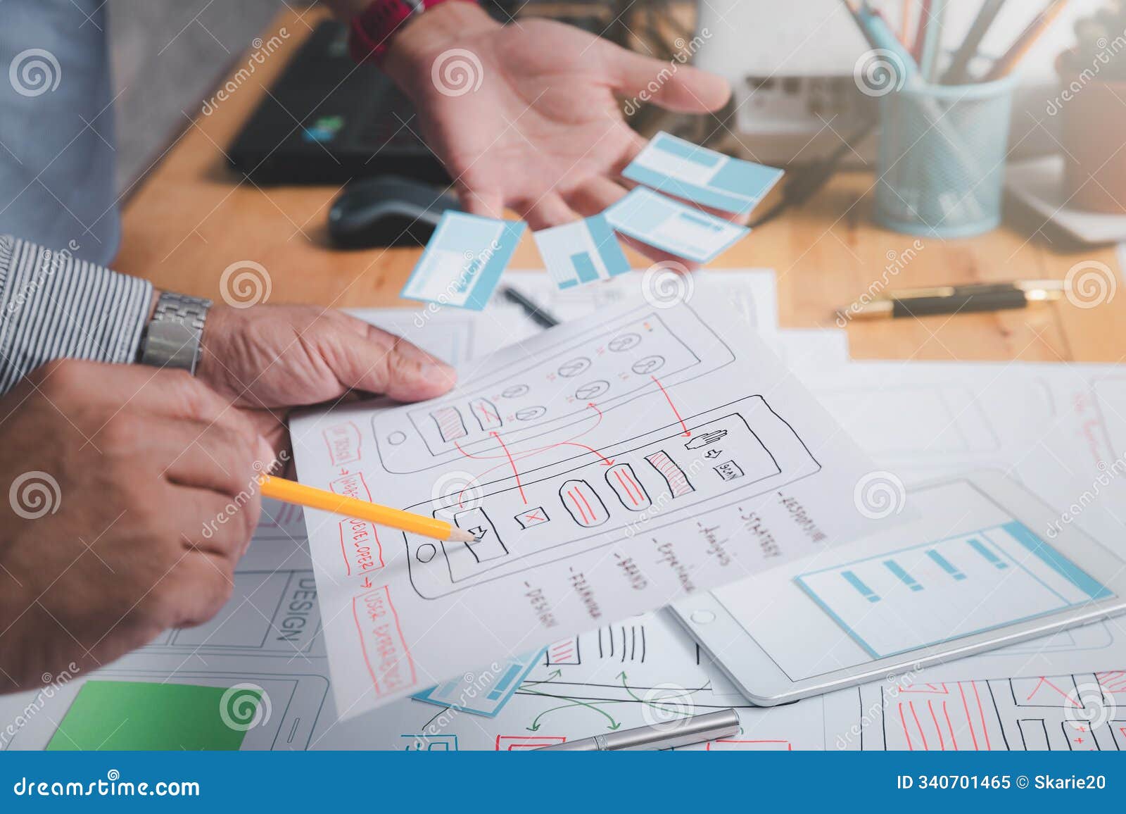 UX or UI Designers Designing on Their Smartphone Application Layout ...