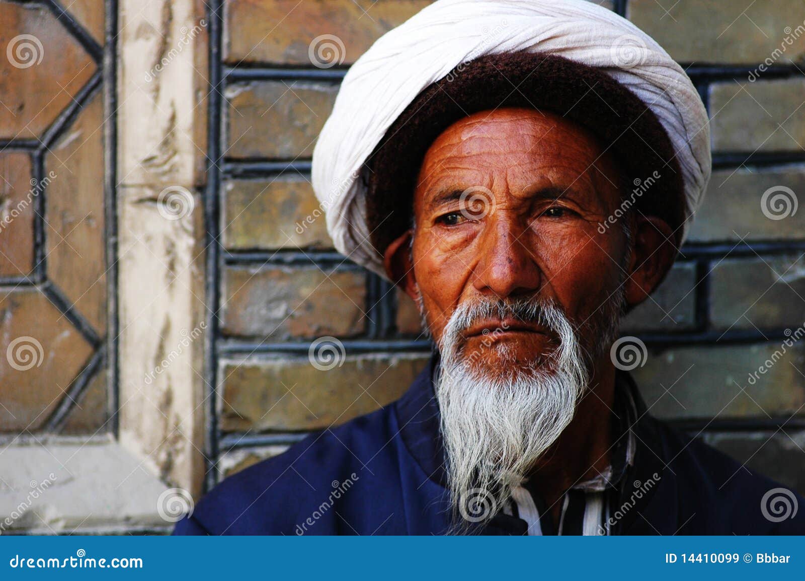 Local Uyghur Man Baking Bread In Traditional Oven At A Bakery Editorial ...