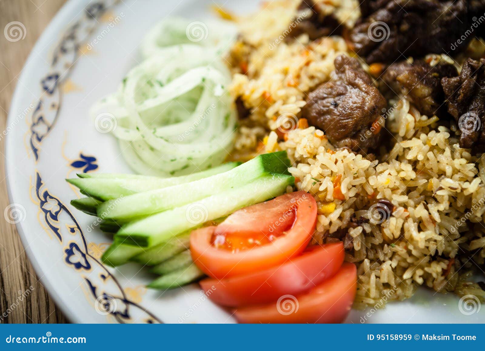 Uzbek Pilaf In Traditional Dishes, Fruits In Background Stock ...