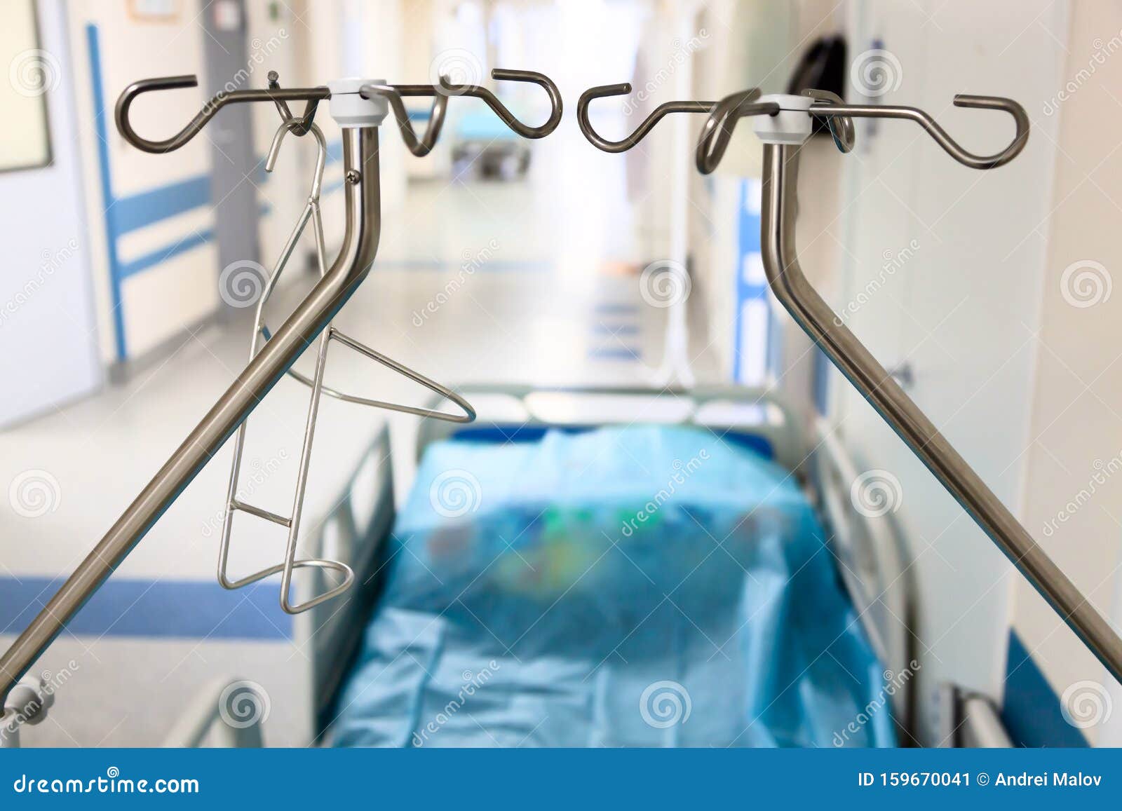 A Vacant Hospital Bed in Hallway with Dropper Stands Stock Image ...