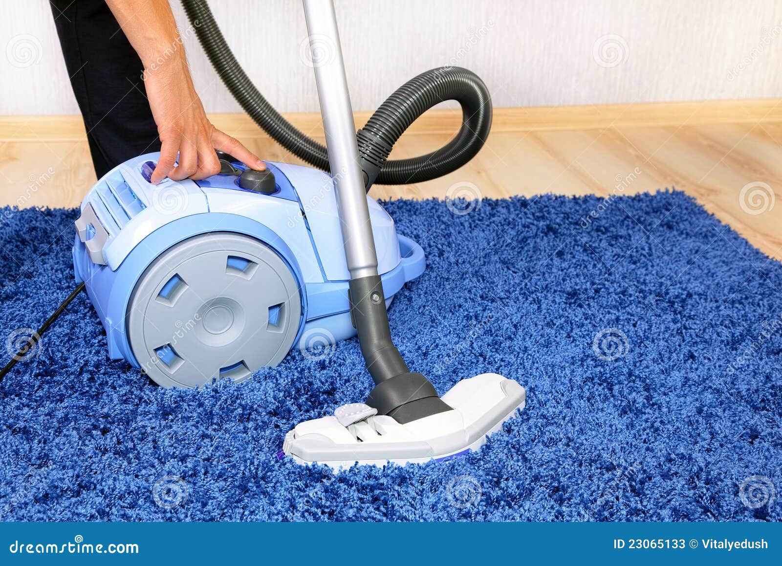 Vacuum Cleaner in Action-men Cleaner a Carpet. Stock Image - Image of ...