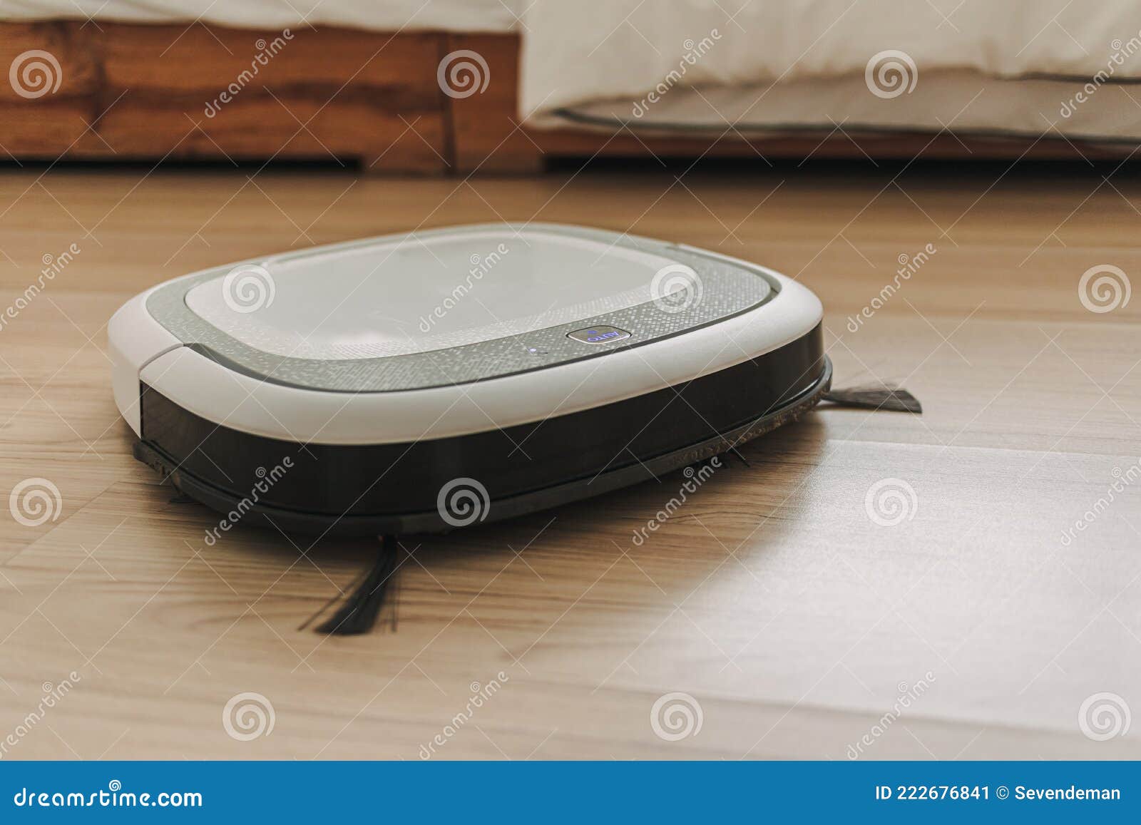 Vacuum Cleaner Bot is Working on the Floor of the Apartment. Stock ...