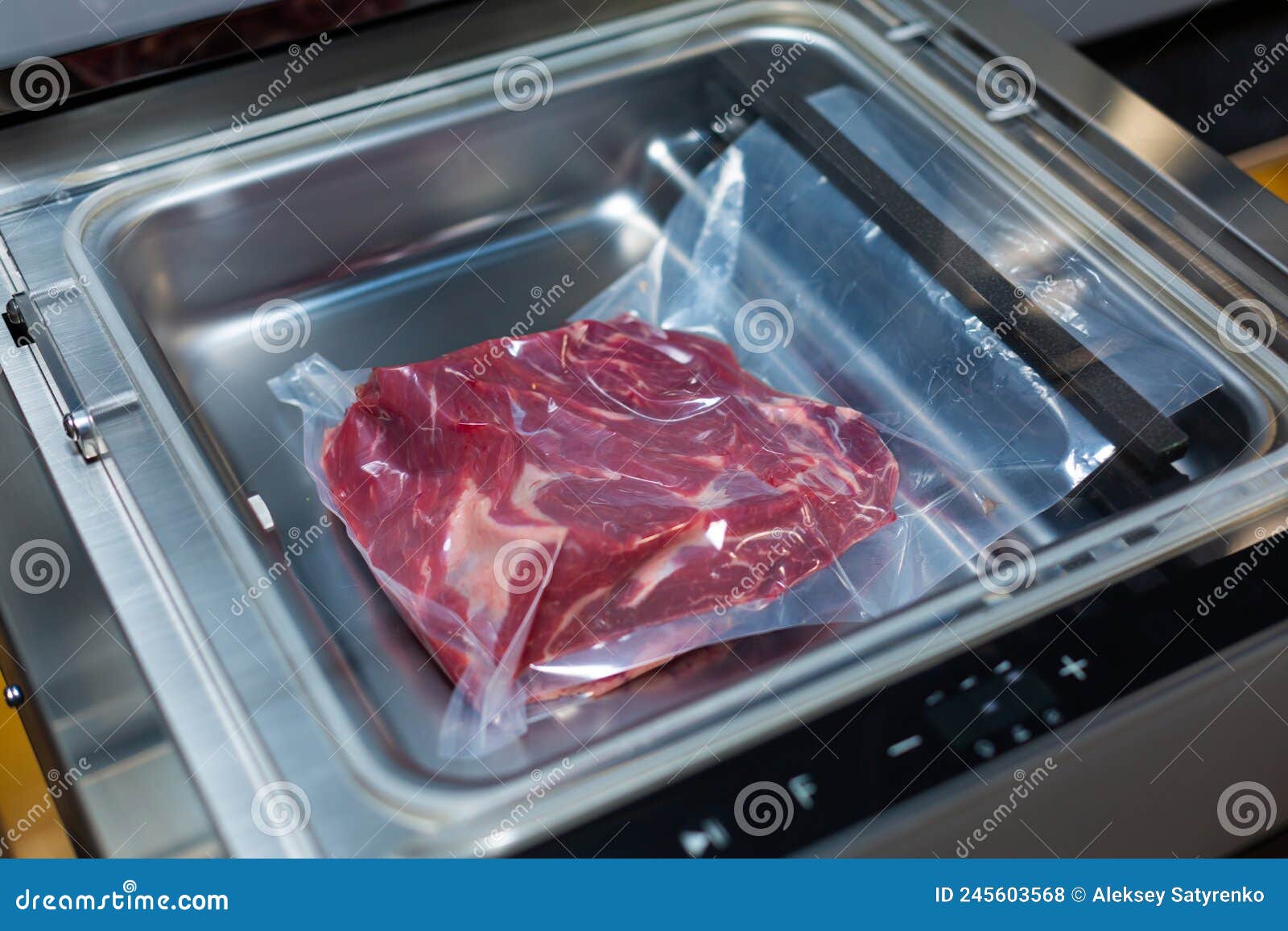 Vacuum Cleaner and Vacuum Packaging of Meat Products Stock Photo ...