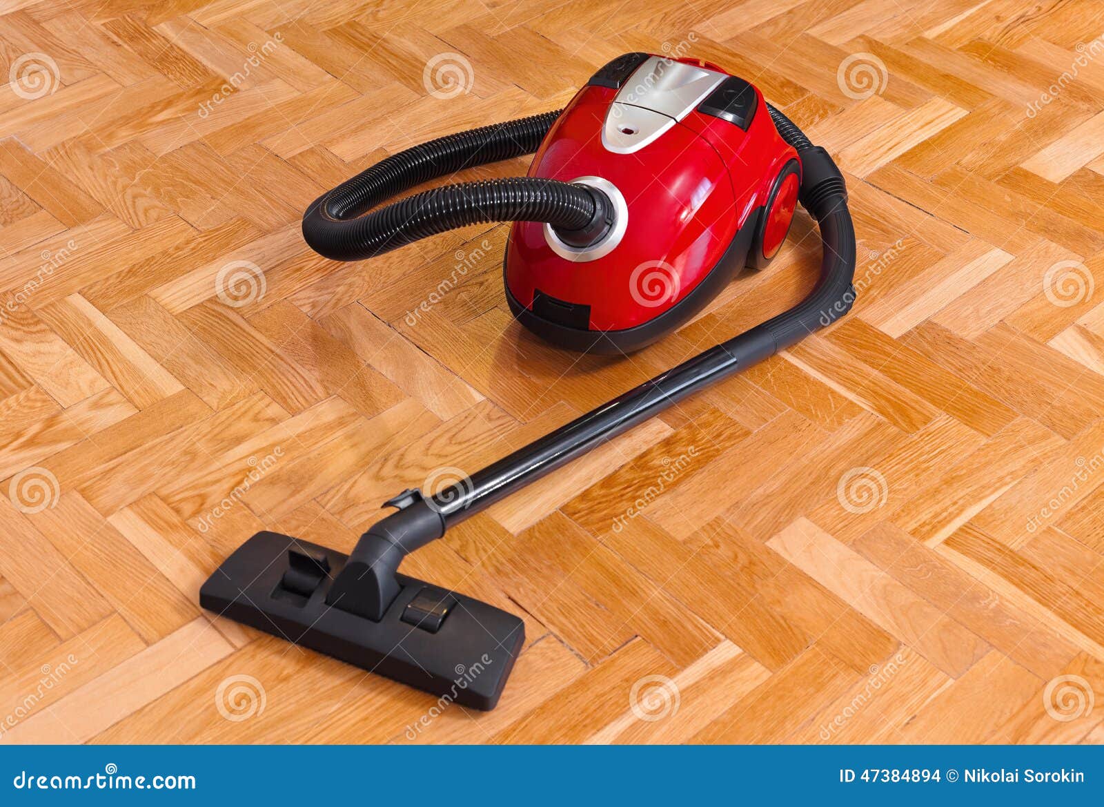 Vacuum cleaner on parquet stock photo. Image of device - 47384894