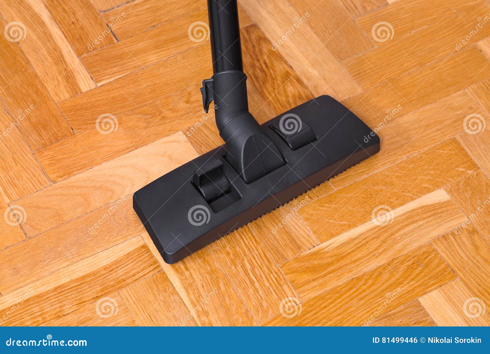 Vacuum cleaner on parquet stock photo. Image of laminate - 81499446