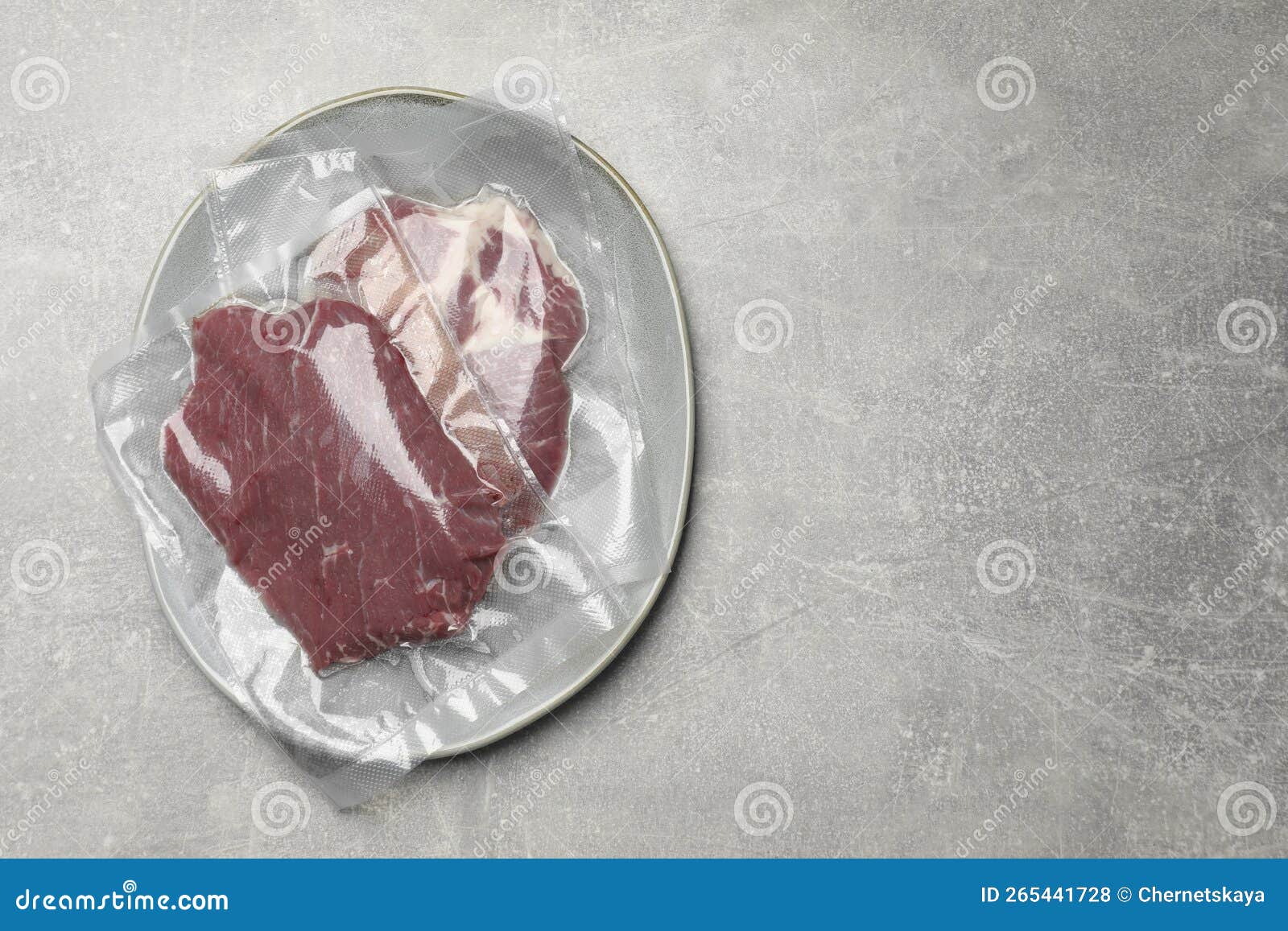 Vacuum Pack of Meat on Light Grey Table, Top View. Space for Text Stock ...