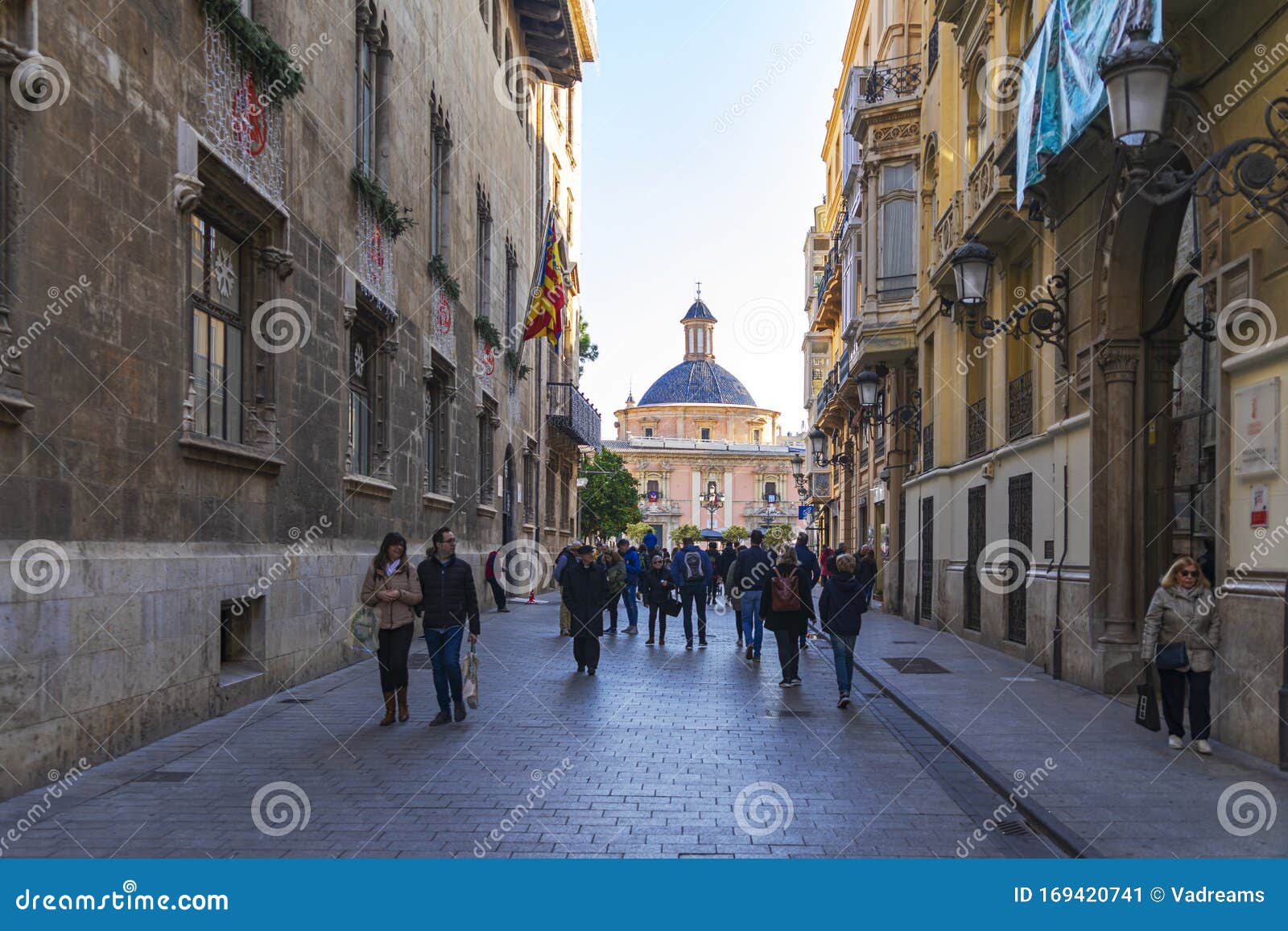 Valencia, Spain - January 2, 2020: People Walking in Carrer Dels ... Valencia, Spain - January 2, 2020: People Walking in Carrer Dels ...