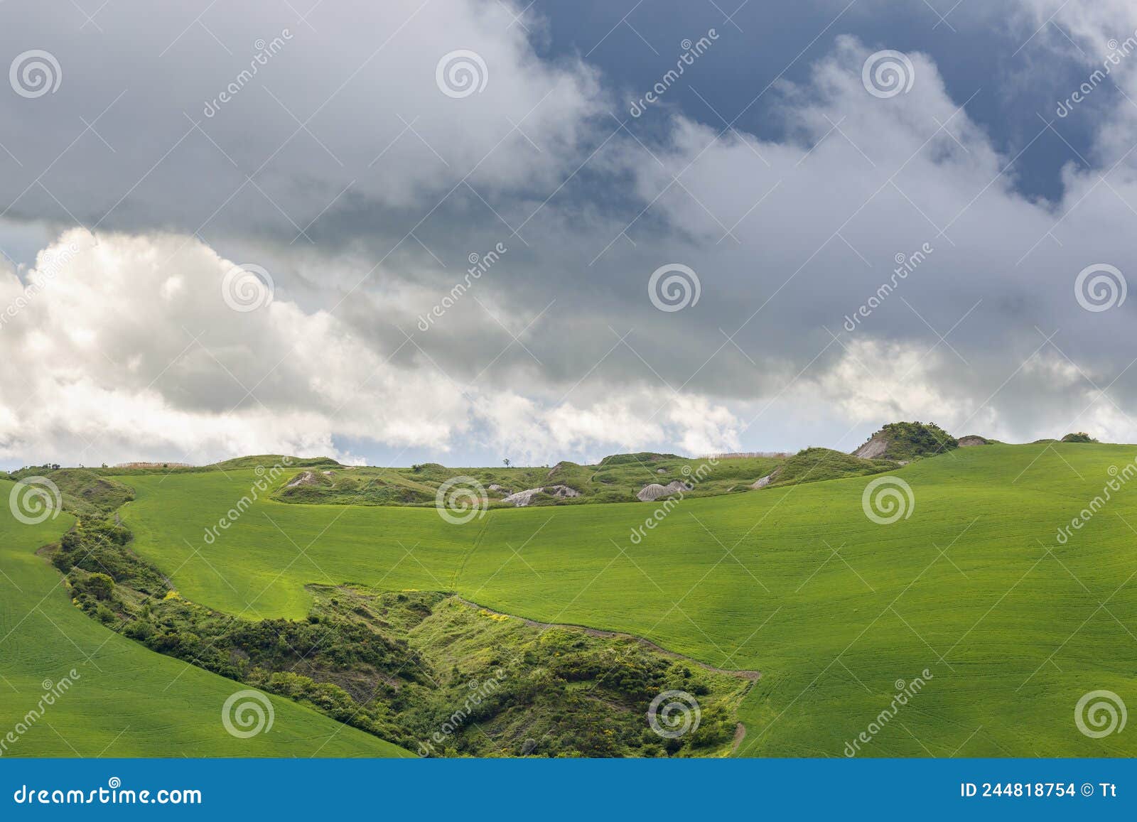 Valley with Fields on the Hillside in a Beautiful Landscape with Storm ...
