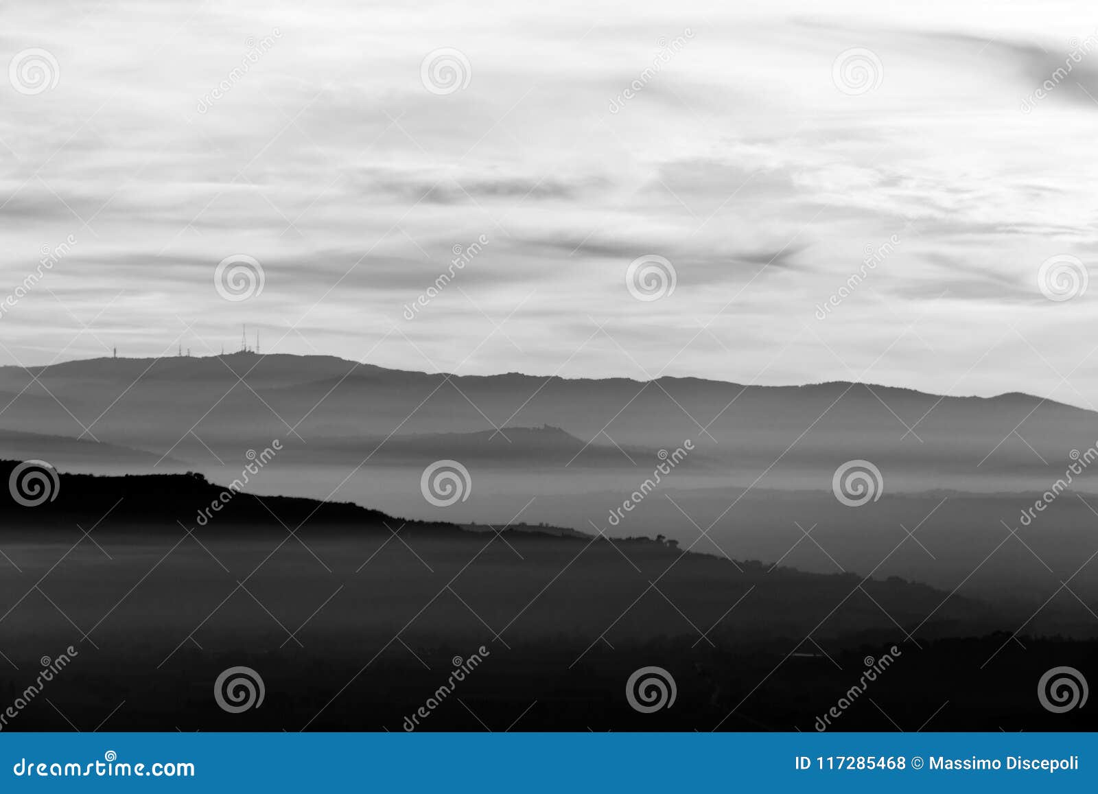 A Valley Filled by Mist at Sunset, with Various Layers of Hills Stock ...